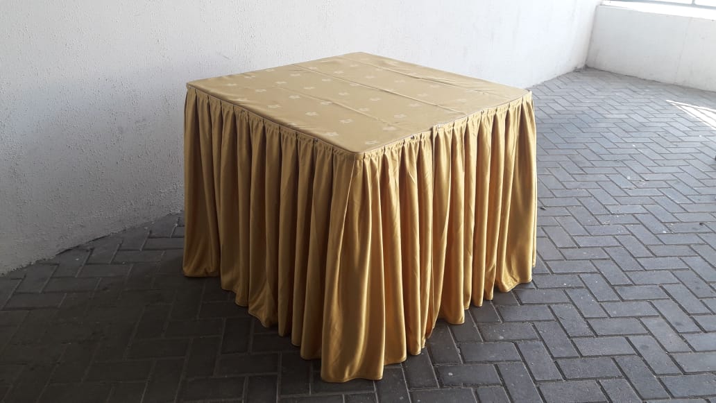 Cake table with gold skirting - Creative Cater Event Rentals